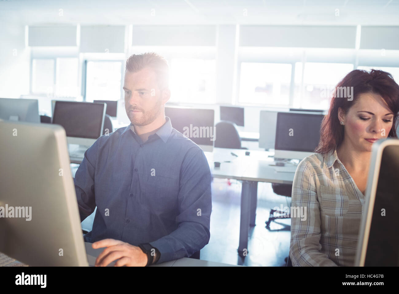 Mature students using computer Stock Photo - Alamy