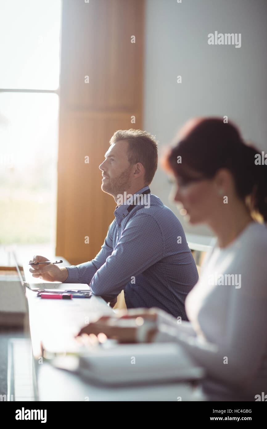 Mature students taking notes Stock Photo - Alamy
