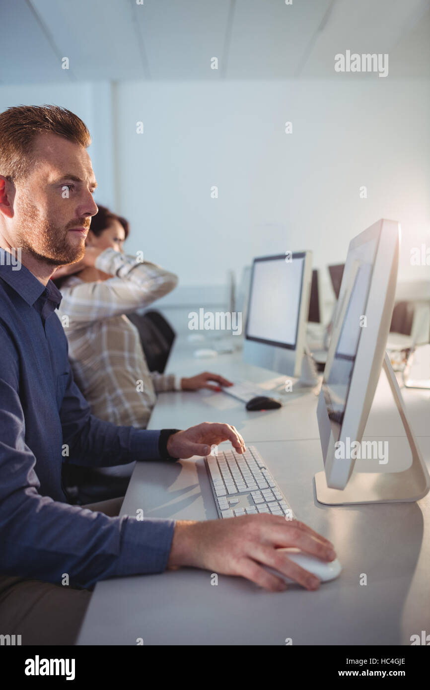 Mature students using computer Stock Photo - Alamy