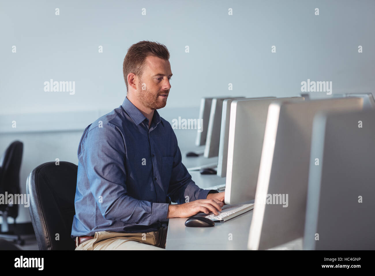 Mature student using computer Stock Photo - Alamy