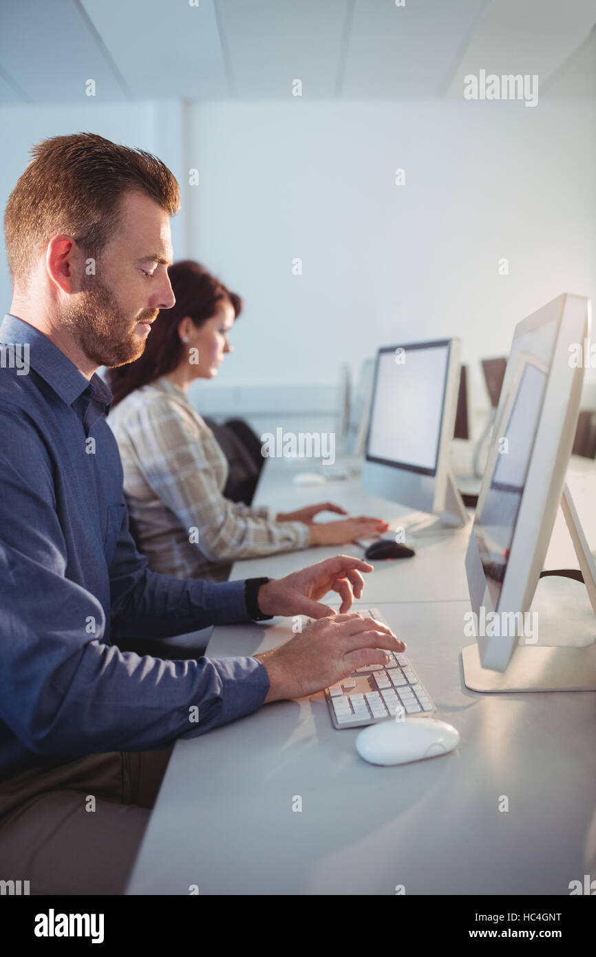 Mature student using computer Stock Photo - Alamy