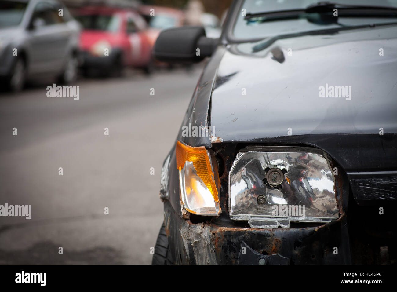 Color image of a crashed car with broken headlight Stock Photo - Alamy