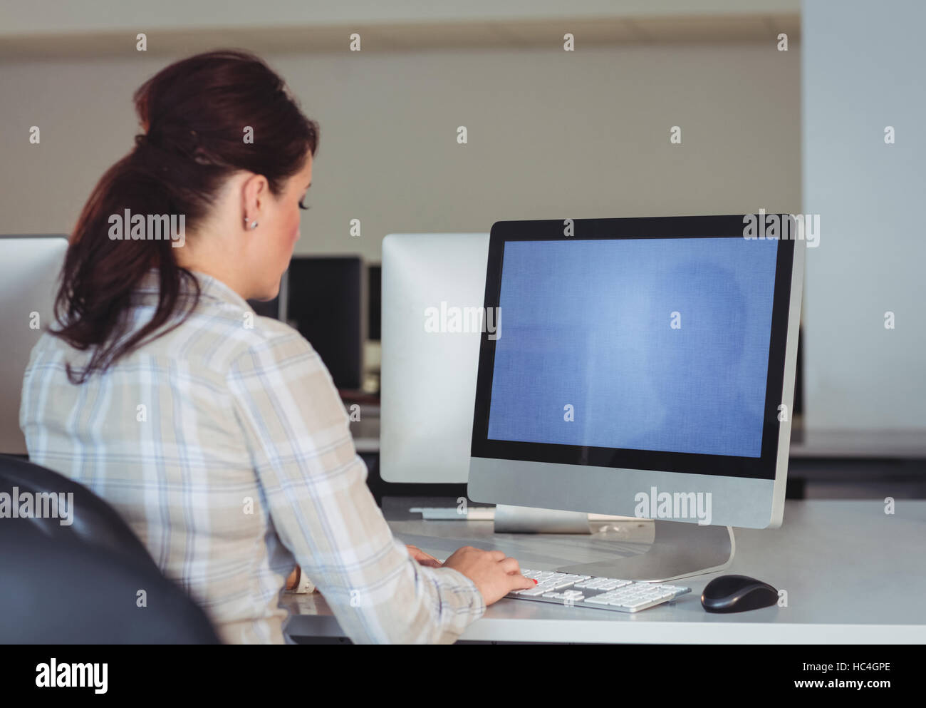 Mature student using computer Stock Photo - Alamy