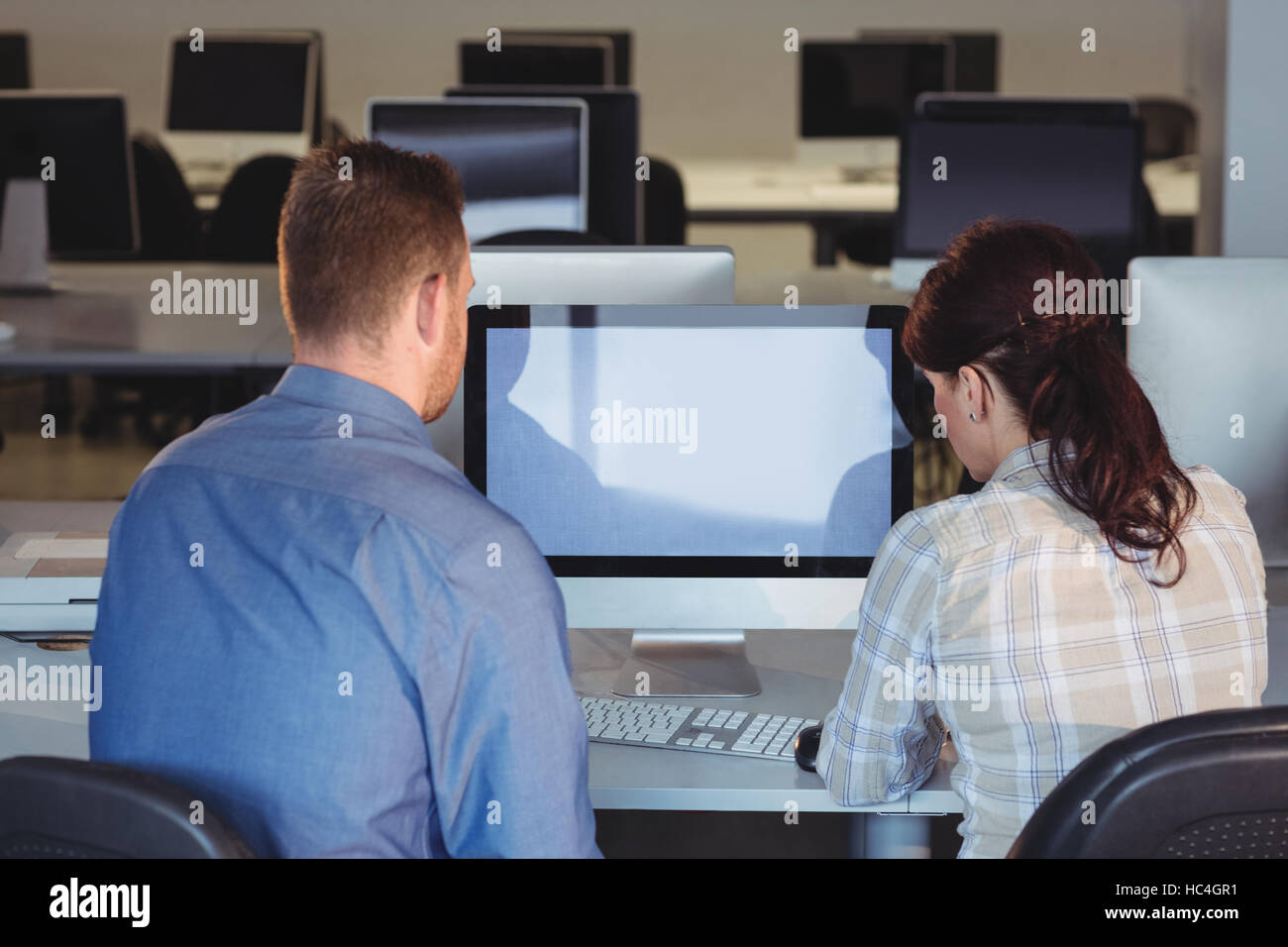 Mature students using computer Stock Photo - Alamy