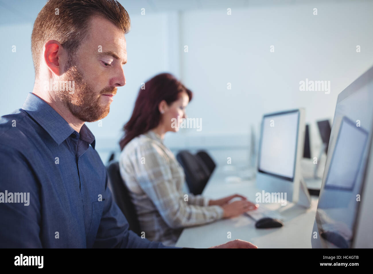 Mature student using computer Stock Photo - Alamy