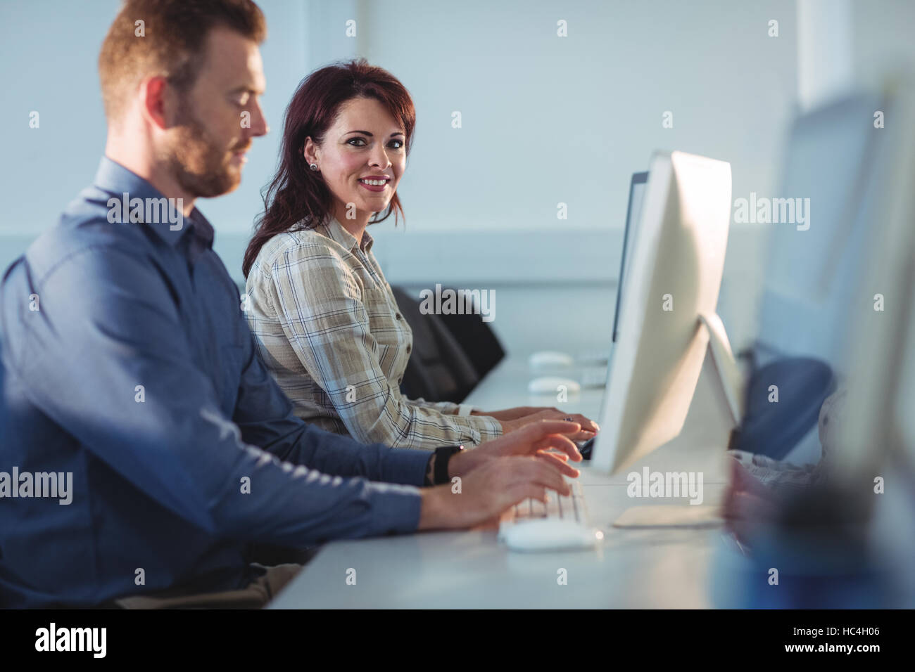 Mature students using computer Stock Photo - Alamy
