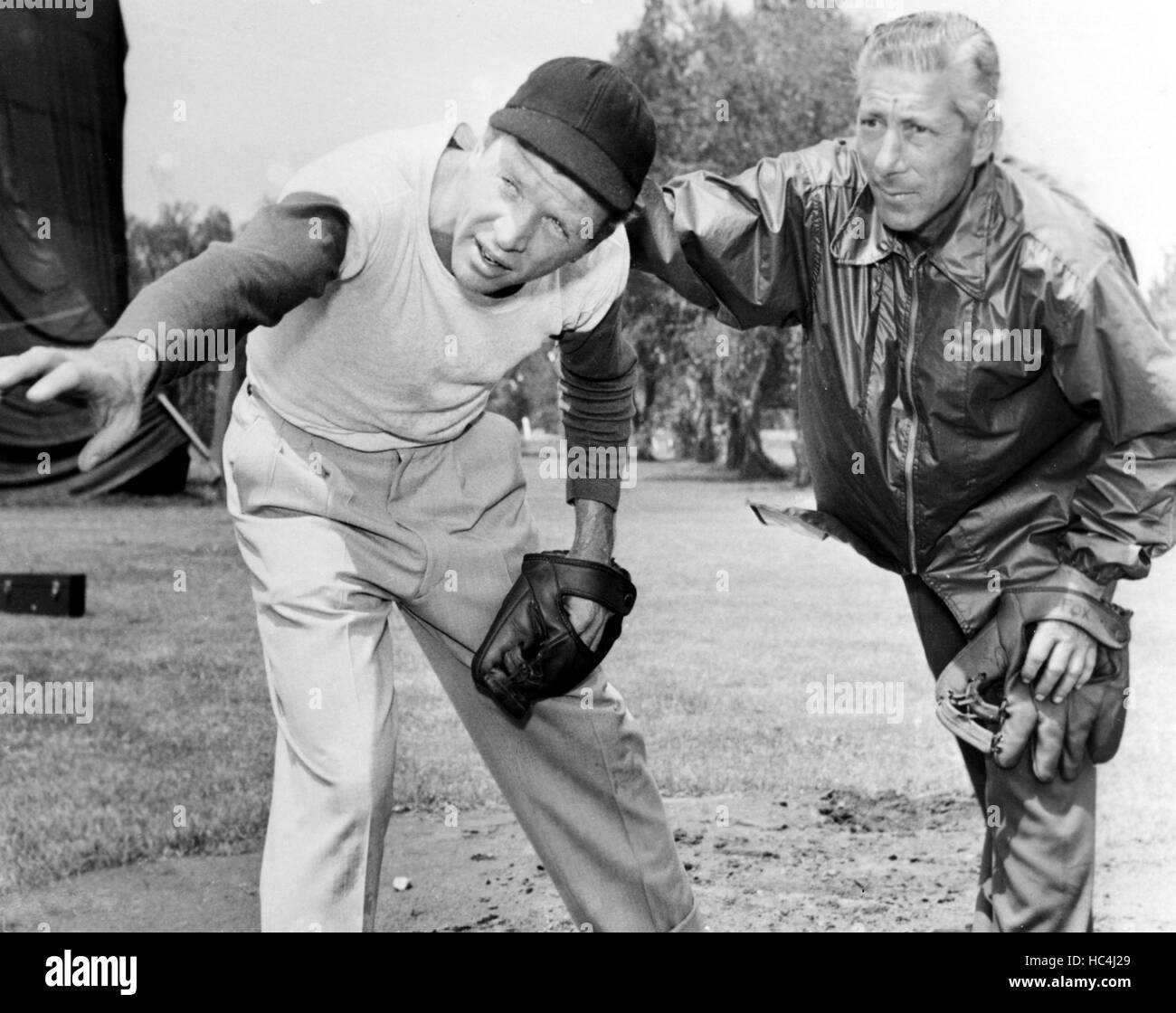 THE PRIDE OF ST.LOUIS, Dan Dailey, being coached to pitch a baseball ...