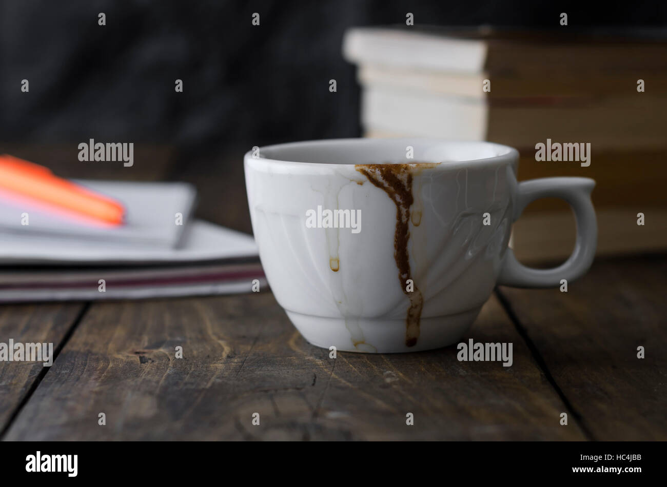 Busy working desk with stained coffee cup Stock Photo - Alamy