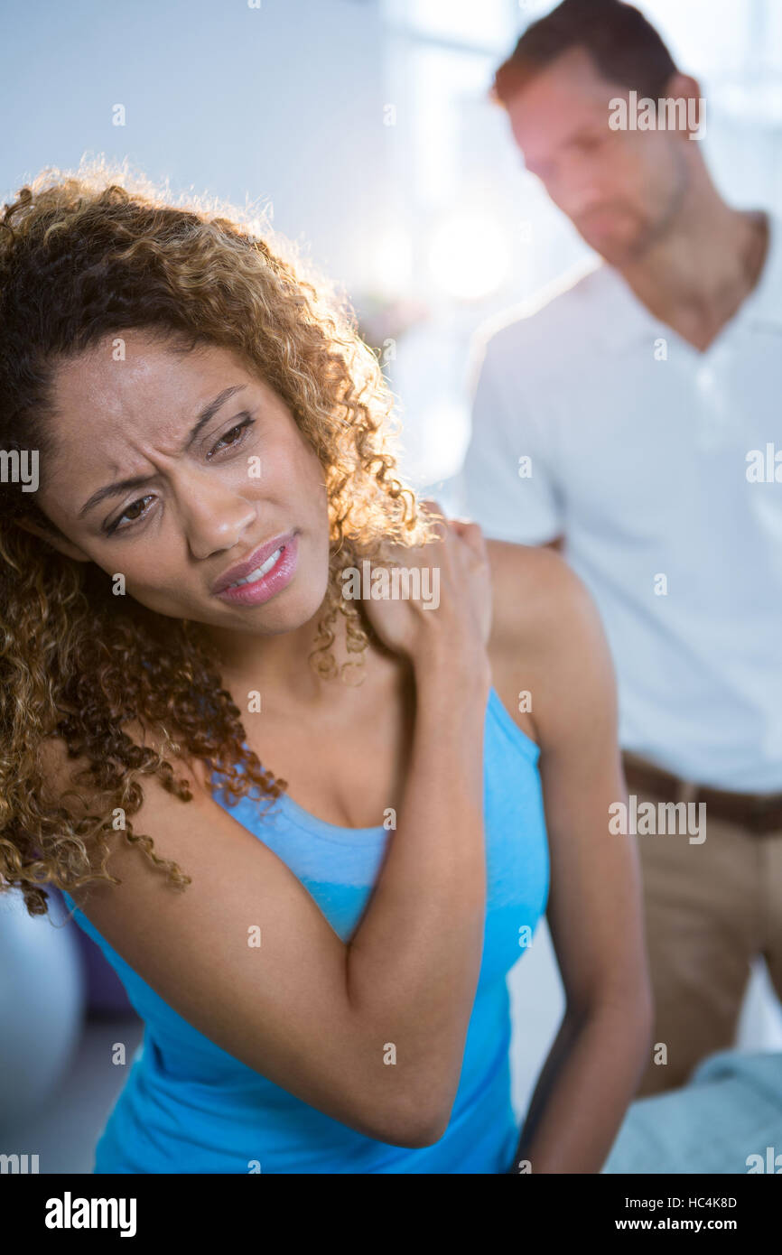 Patient expressing problem with neck pain Stock Photo - Alamy