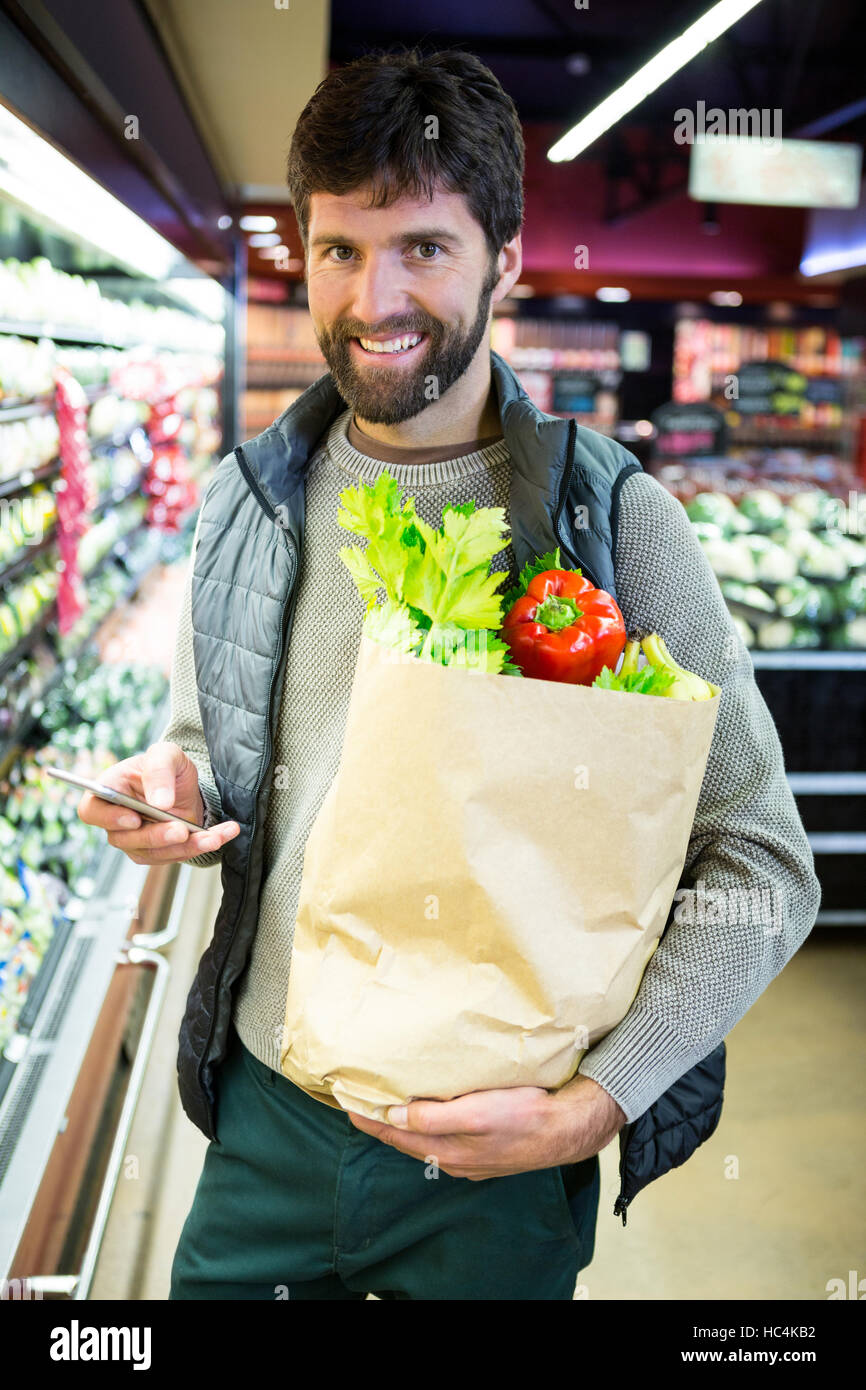 Man with grocery bag hi-res stock photography and images - Alamy