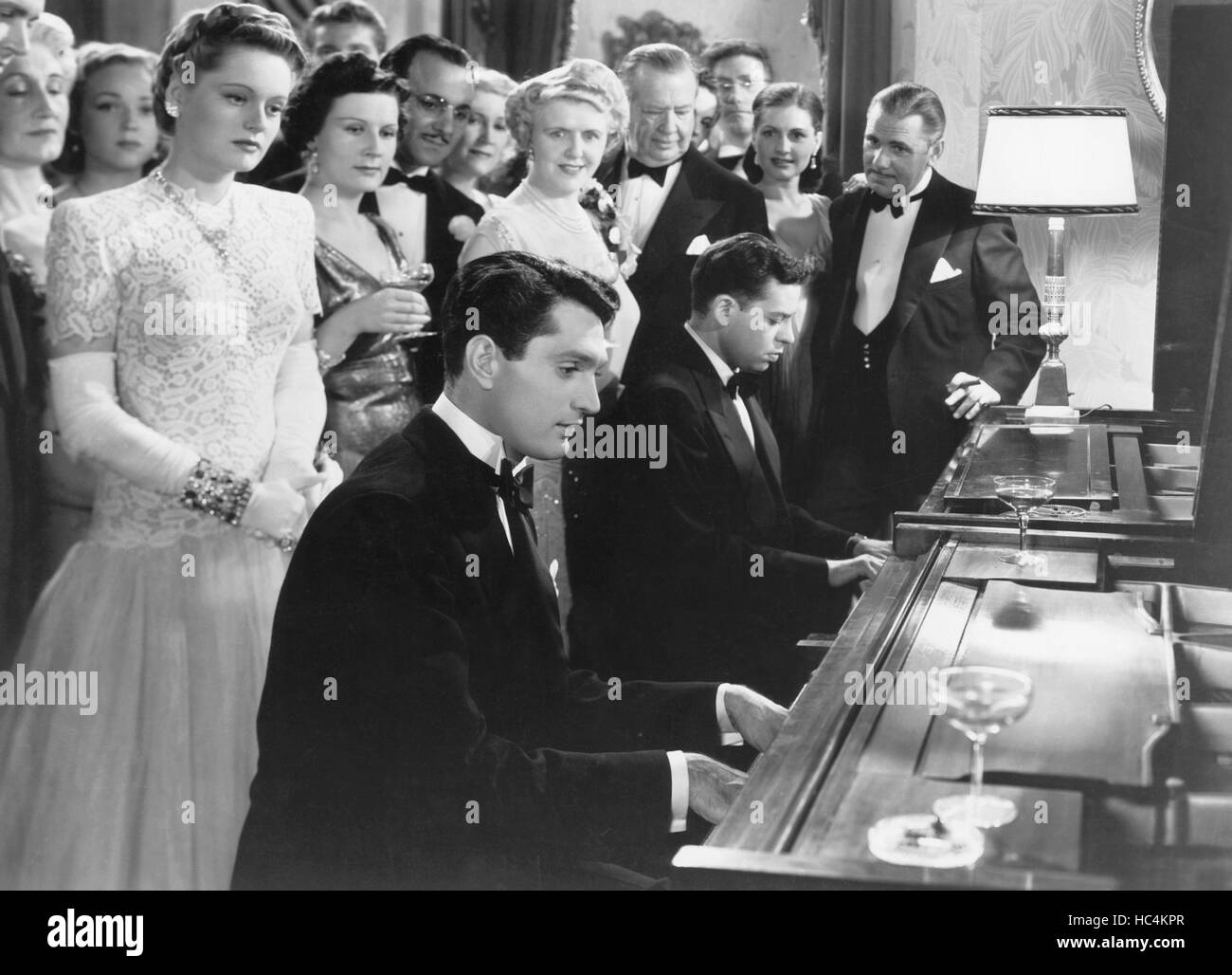 RHAPSODY IN BLUE, from left, Alexis Smith, (standing), Robert Alda ...