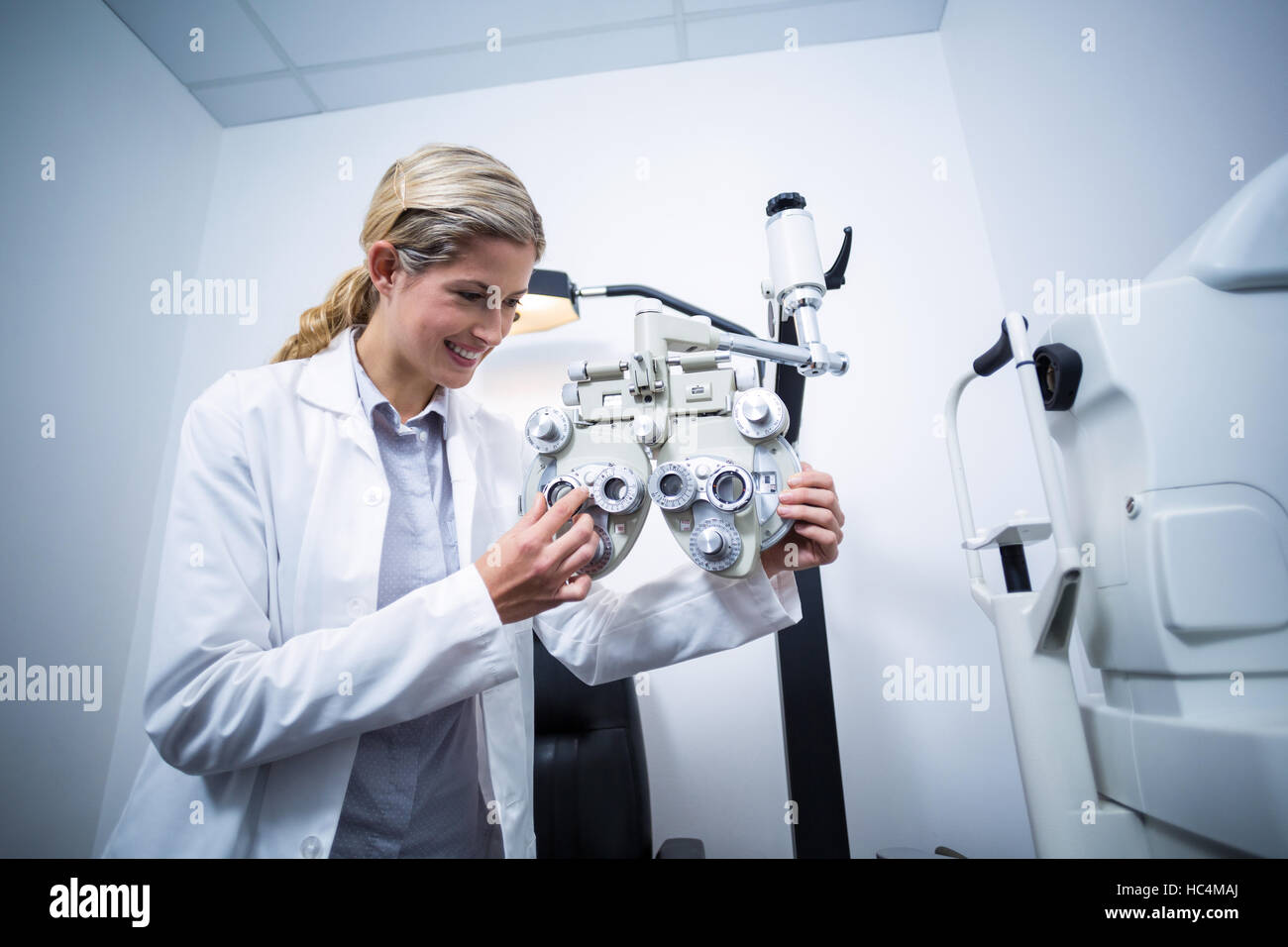 Female doctor adjusting equipment hi-res stock photography and images ...