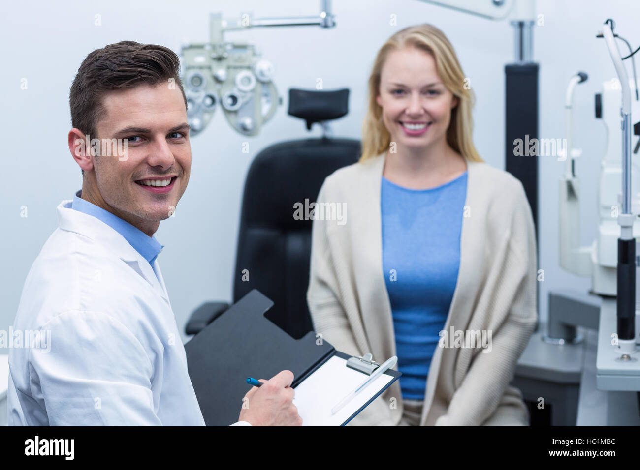 Pretty optometrist smiling camera hi-res stock photography and images ...