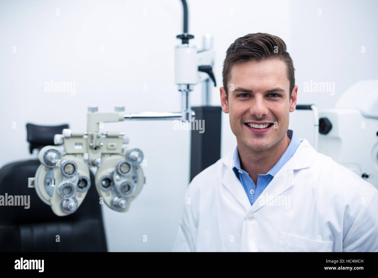Portrait of smiling optometrist Stock Photo - Alamy