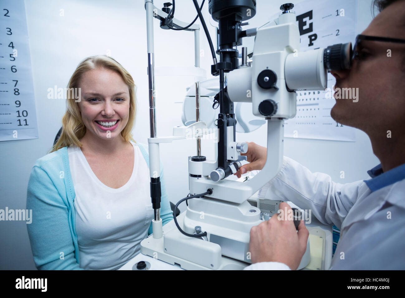 Portrait of female patient smiling in ophthalmology clinic Stock Photo ...