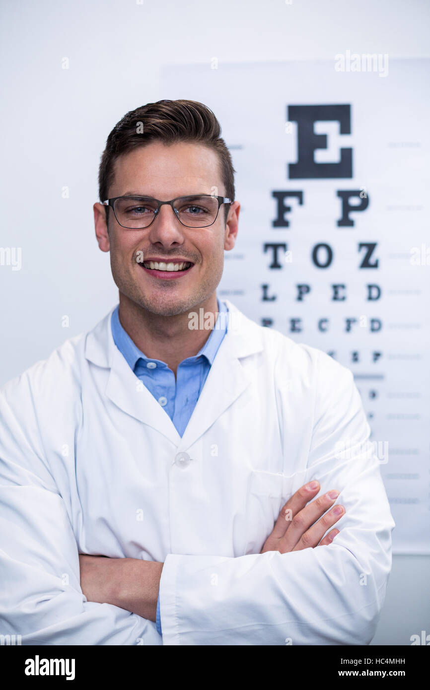 Optometrist smiling in ophthalmology clinic Stock Photo - Alamy