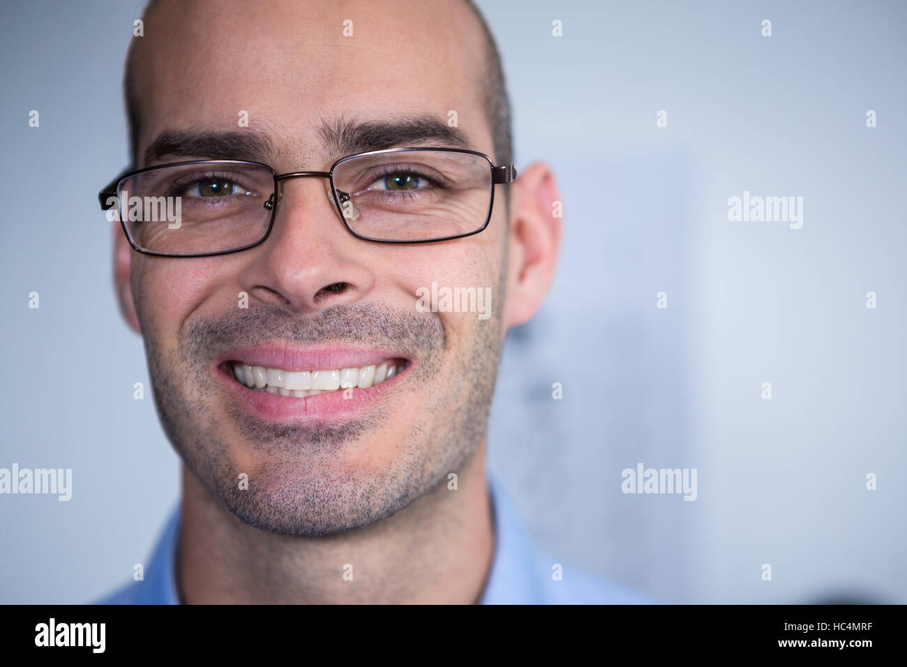 Optometrist wearing spectacles in ophthalmology clinic Stock Photo - Alamy