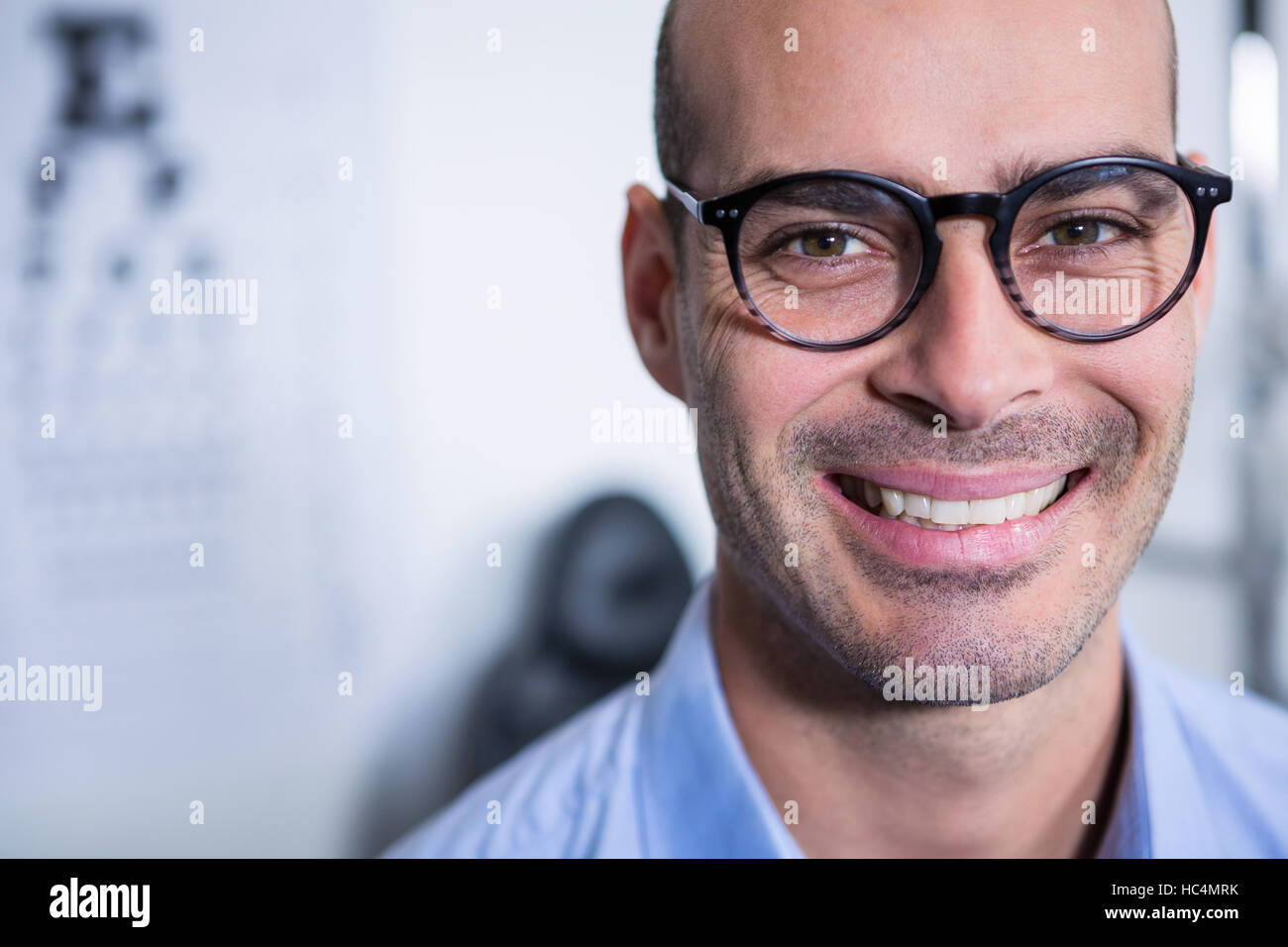 Optometrist wearing spectacles in ophthalmology clinic Stock Photo - Alamy