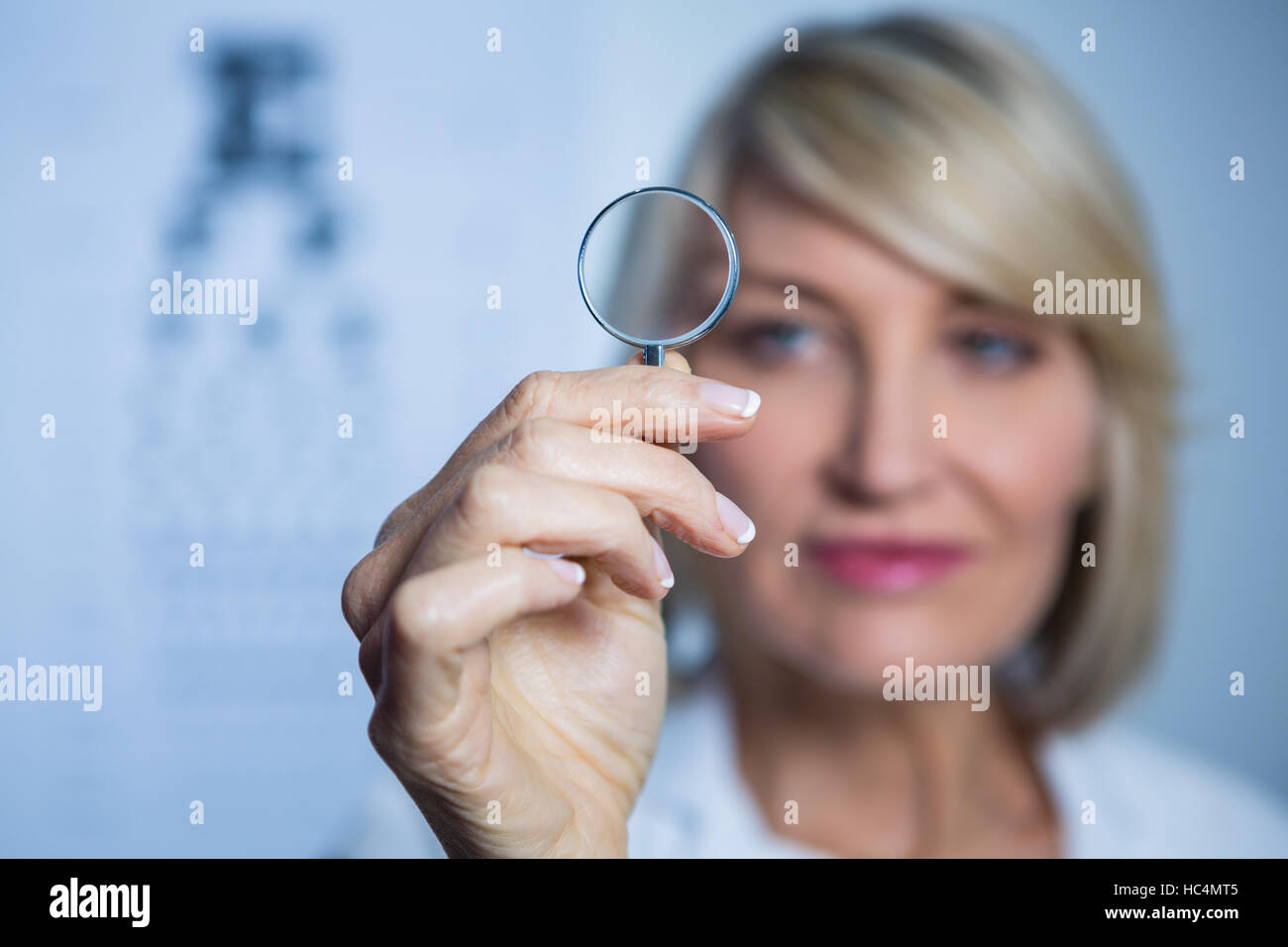 Beautiful female ophthalmologist holding hi-res stock photography and ...
