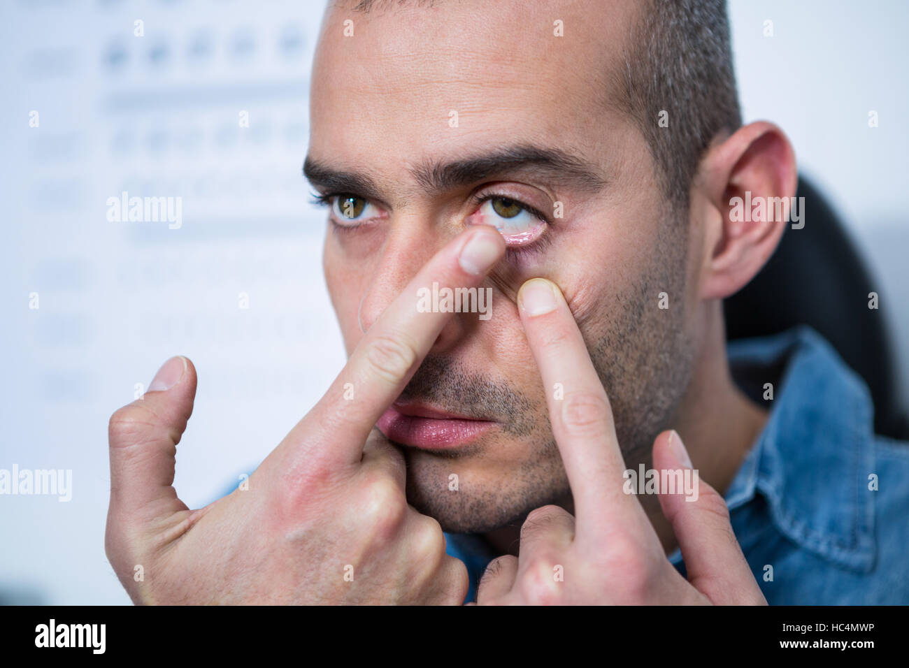 Man applying contact lens Stock Photo - Alamy