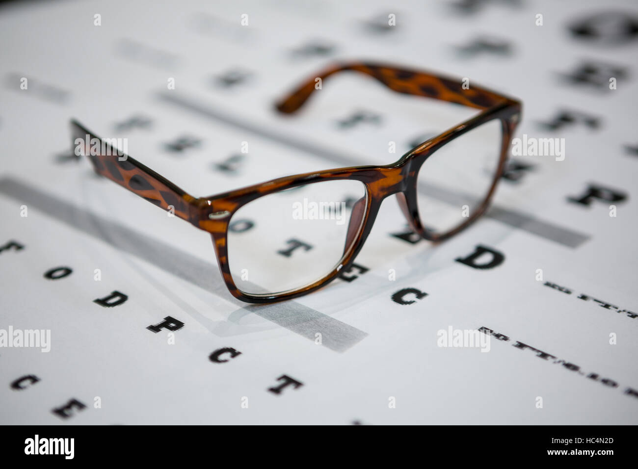 Close-up of spectacles on eye chart Stock Photo - Alamy