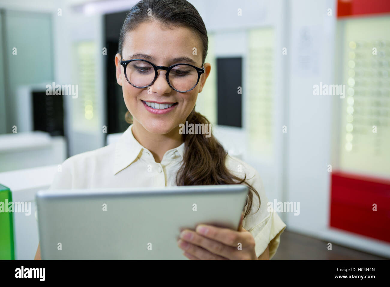 Female customer using digital tablet Stock Photo - Alamy