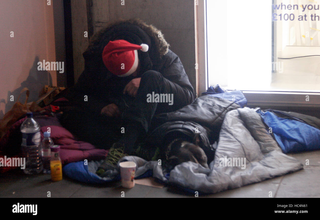 Homeless man outside shop hi-res stock photography and images - Alamy