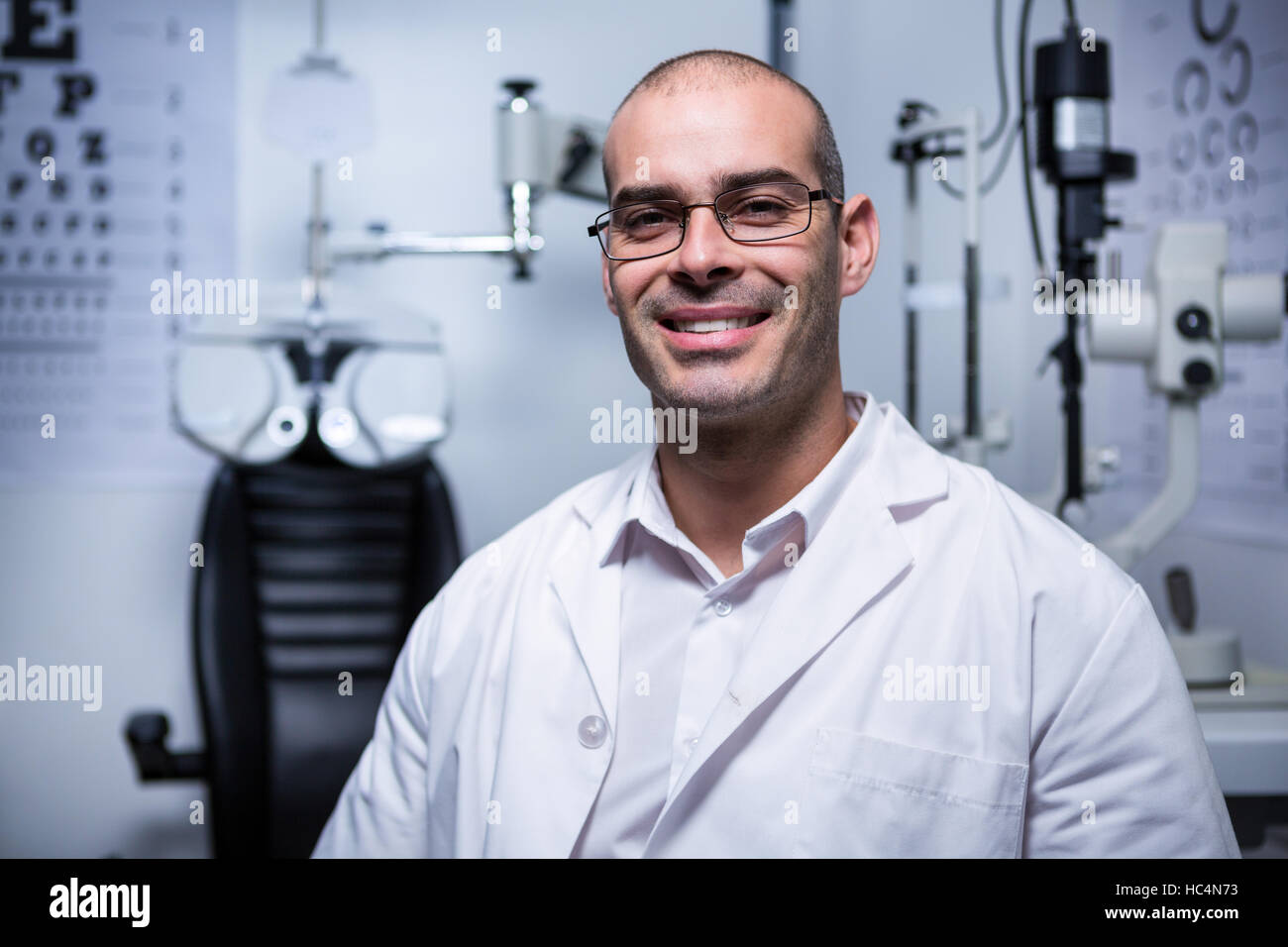 Portrait of male optometrist smiling Stock Photo - Alamy