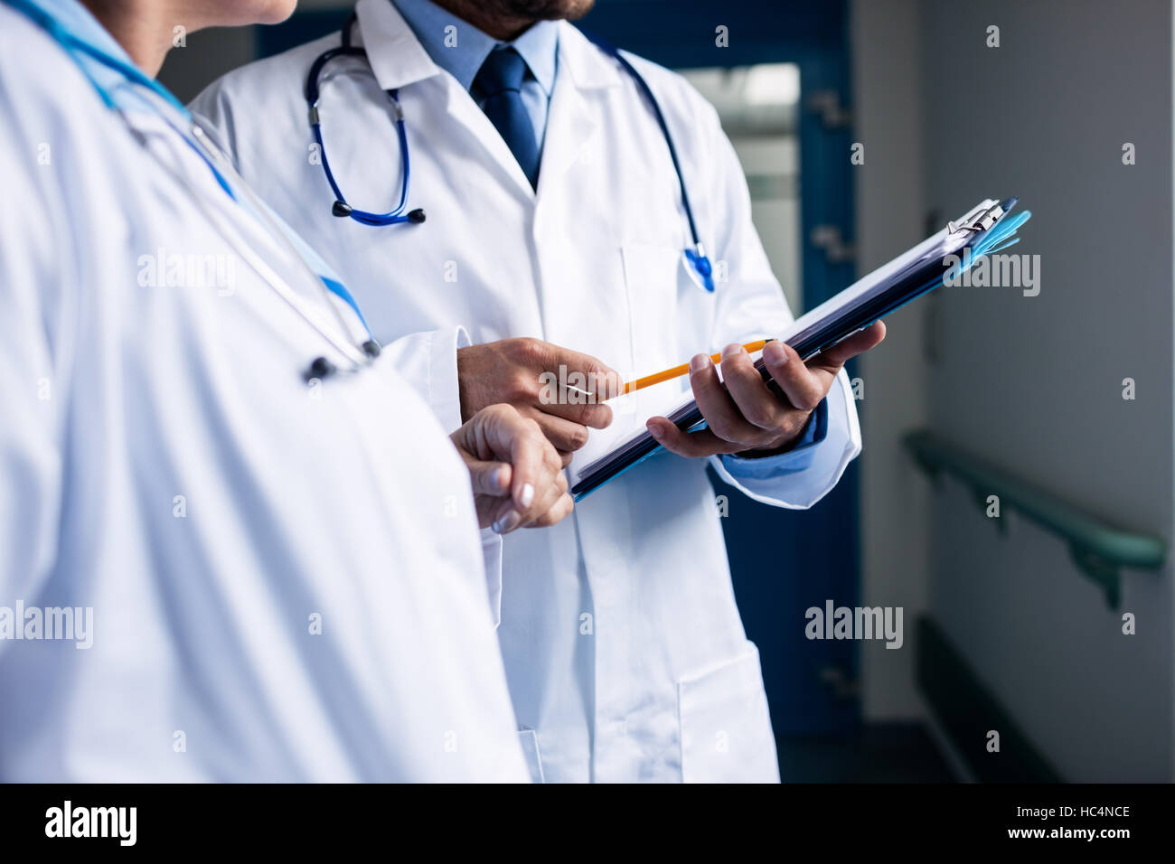 Doctors interacting with each other Stock Photo - Alamy