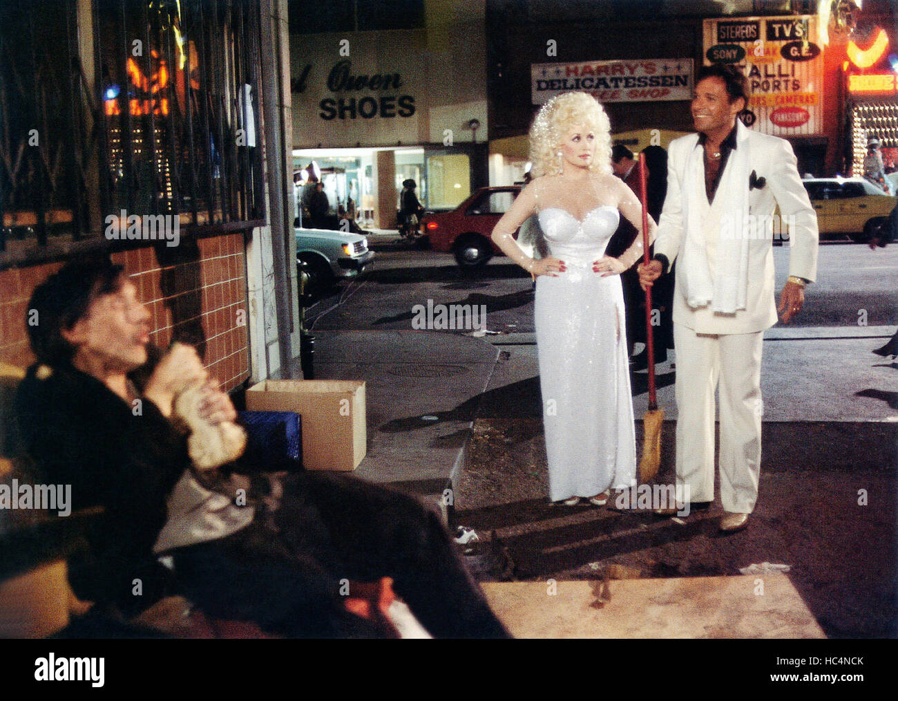 RHINESTONE, standing from left: Dolly Parton, Ron Leibman, 1984, TM ...