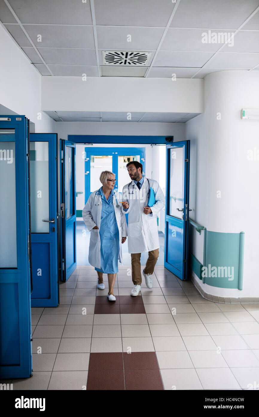 Doctors walking together in corridor Stock Photo - Alamy