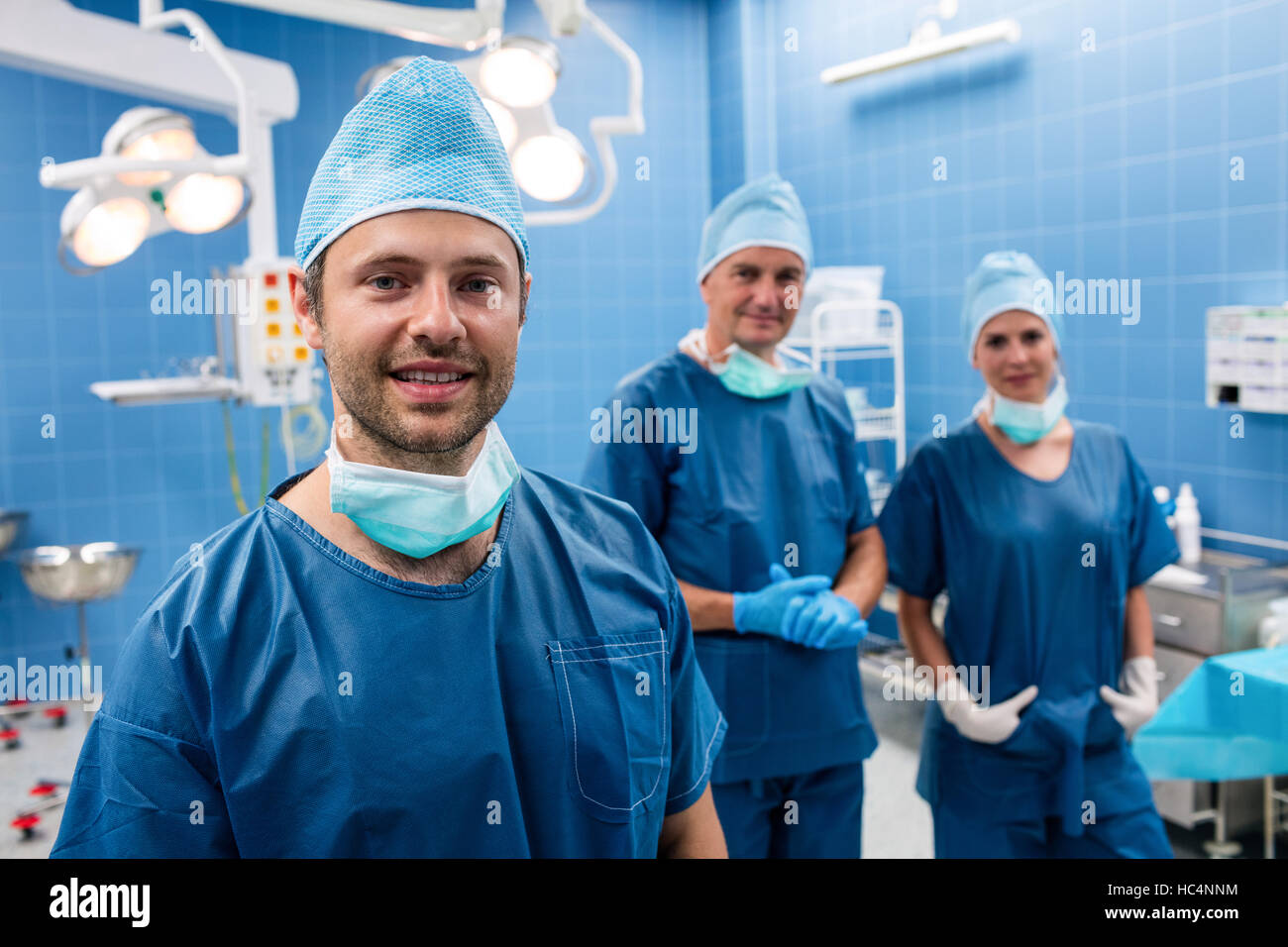 Portrait of surgeons smiling in operation room Stock Photo - Alamy
