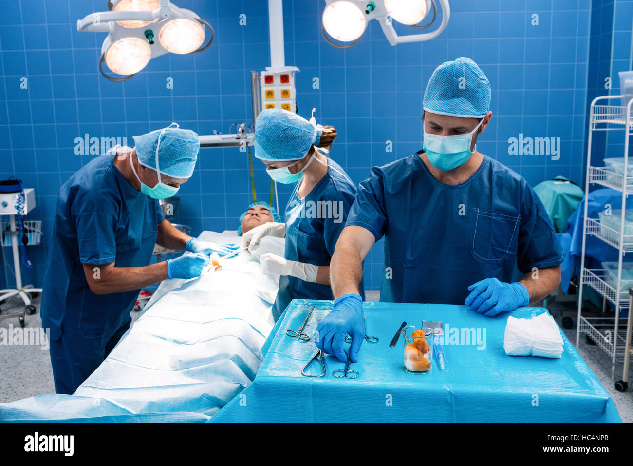 Surgeons performing operation in operation room Stock Photo - Alamy
