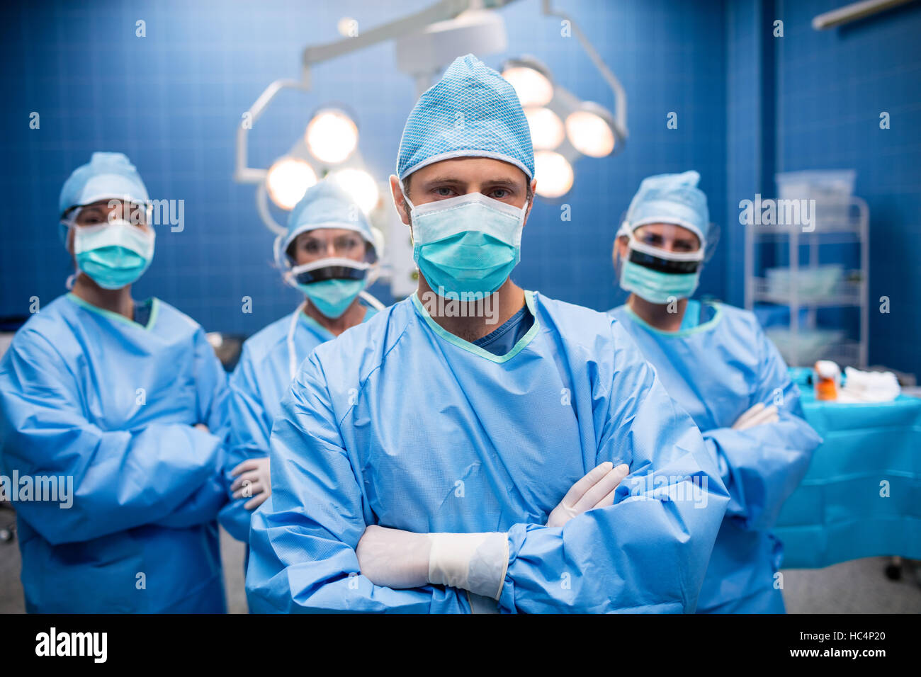 Portrait of surgeons standing in operation room Stock Photo - Alamy