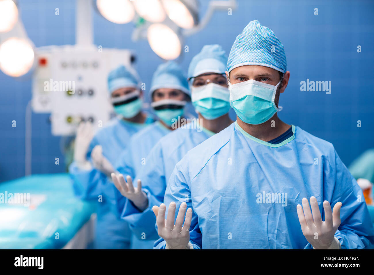 Portrait of surgeons standing in operation room Stock Photo - Alamy