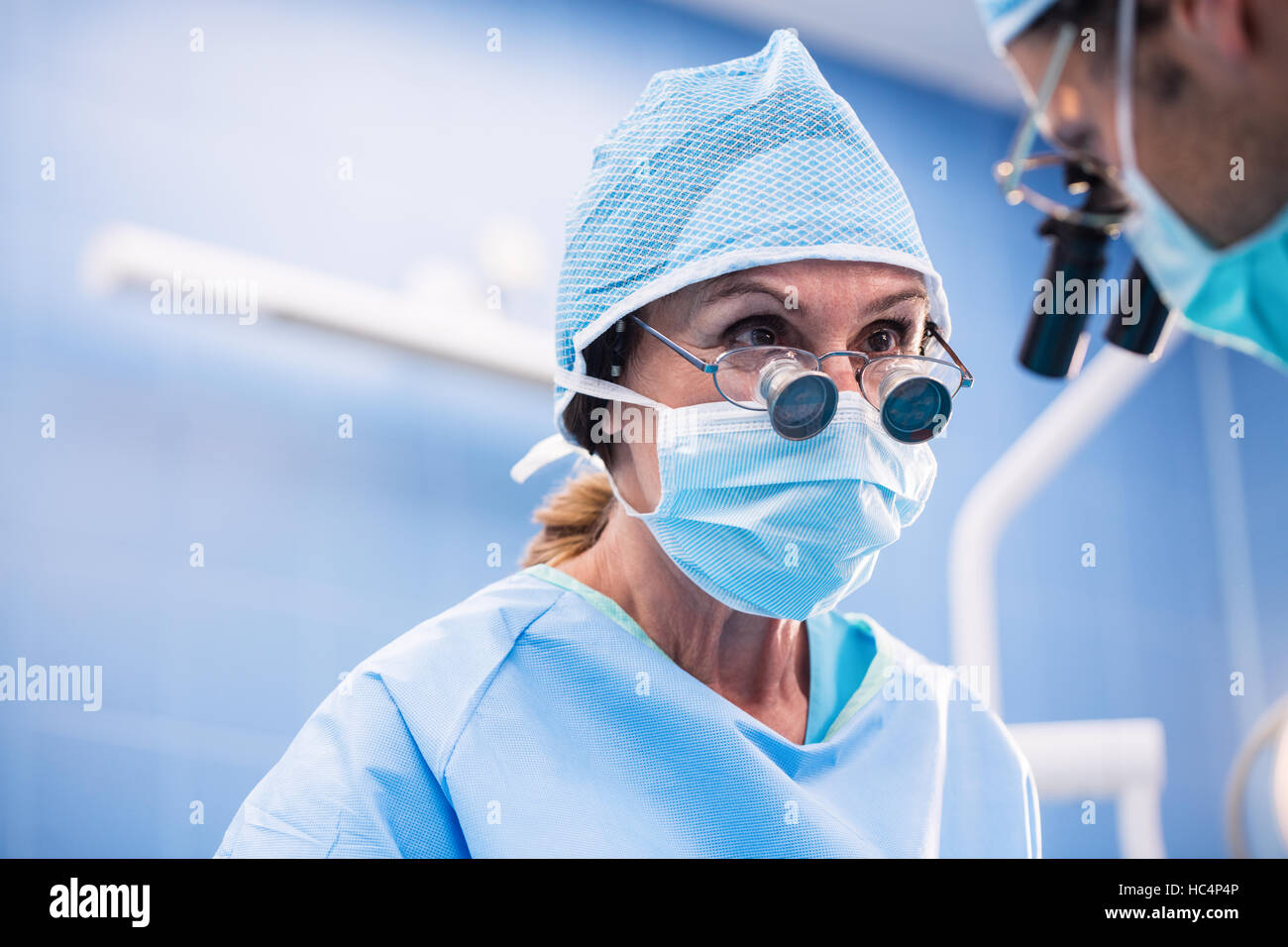 Elderly doctor performing surgery hi-res stock photography and images ...