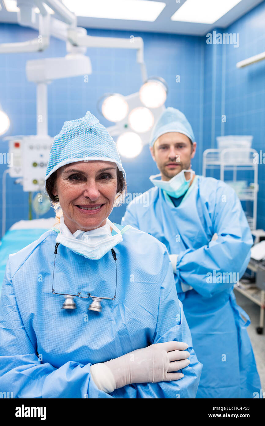 Portrait of surgeons standing in operation room Stock Photo - Alamy