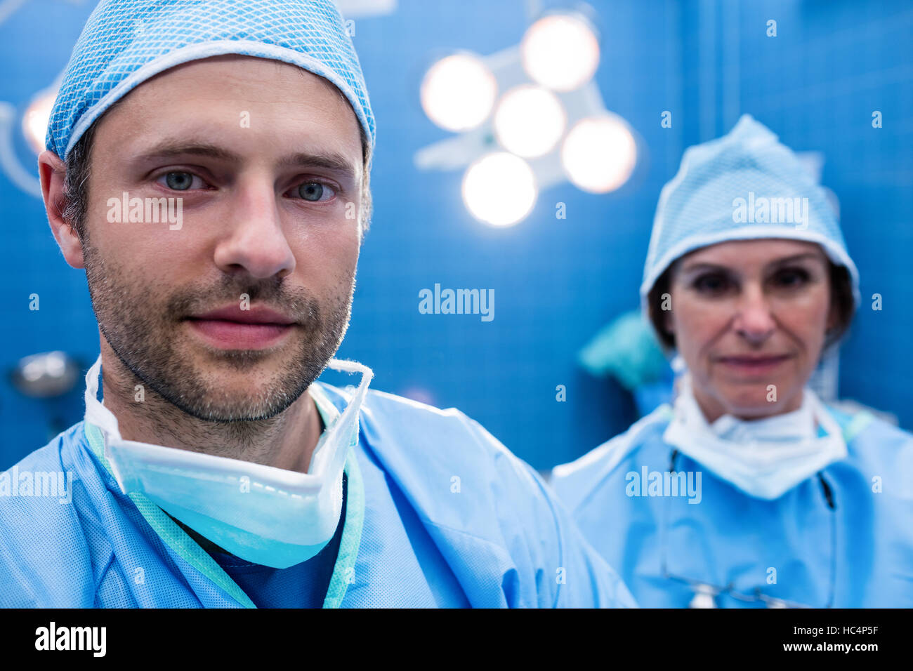 Portrait of surgeons standing in operation room Stock Photo - Alamy