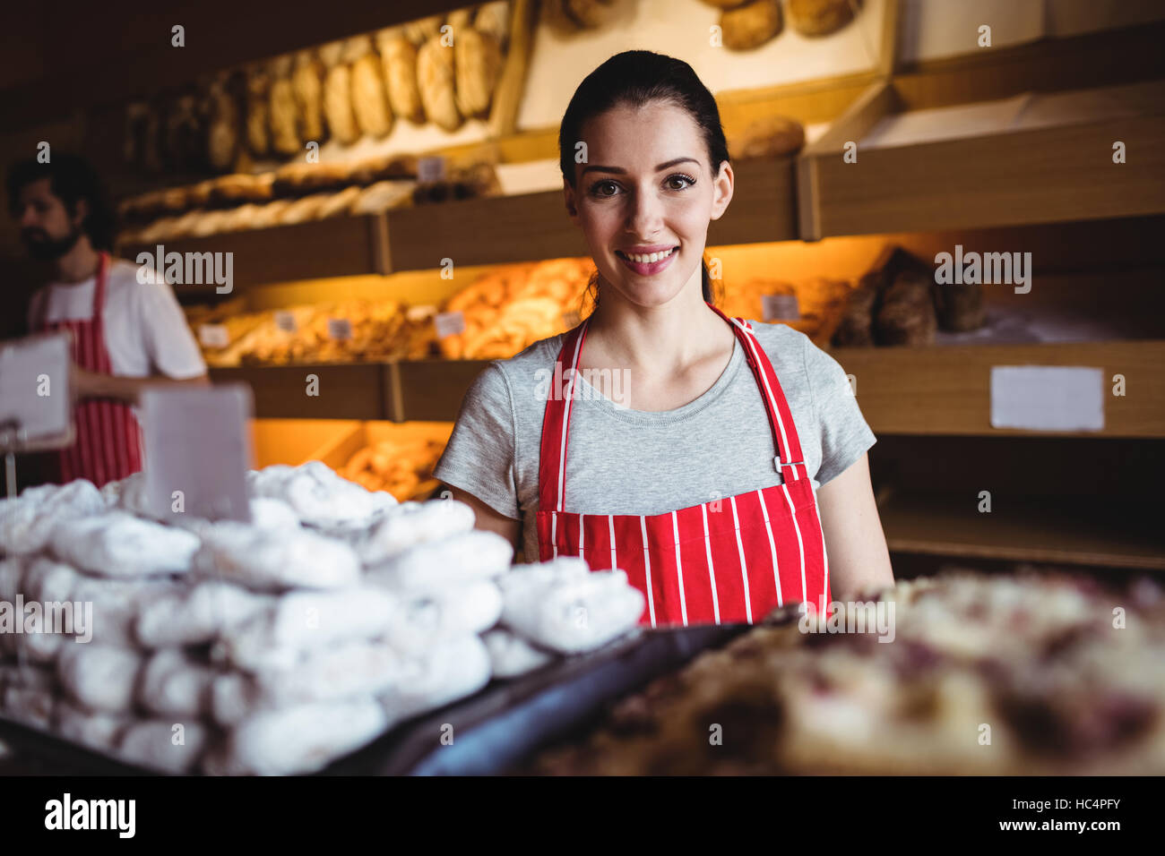 Portrait of female baker smiling Stock Photo - Alamy