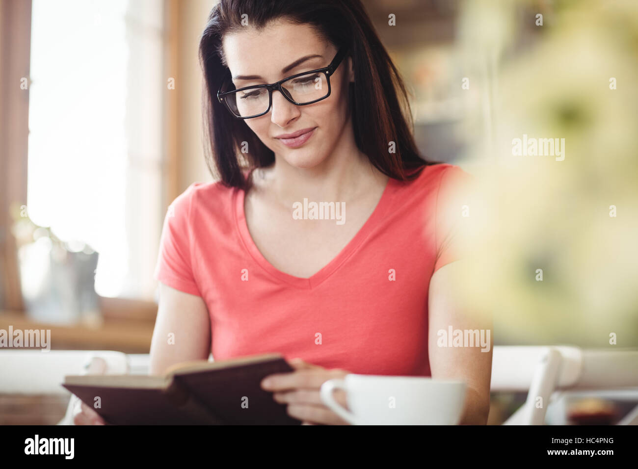 Beautiful woman reading a book Stock Photo - Alamy