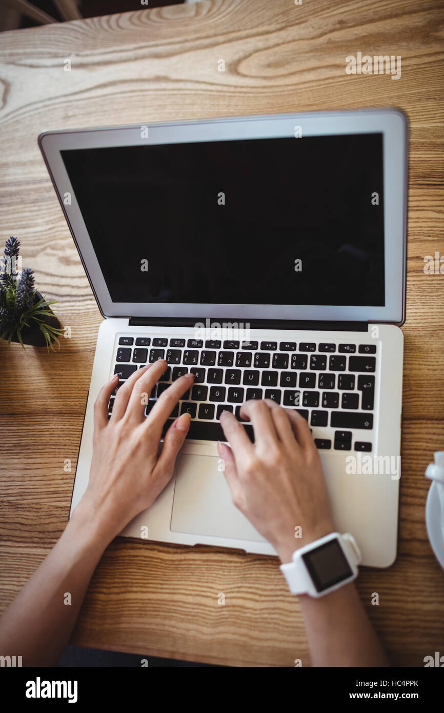 Hands of woman using laptop Stock Photo - Alamy