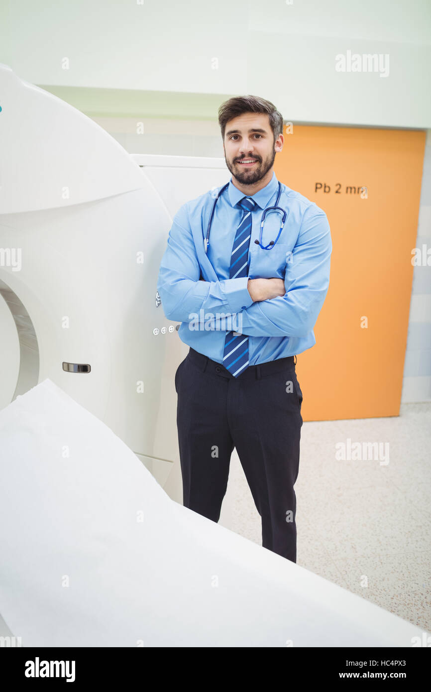 Portrait of doctor standing near mri scanner Stock Photo - Alamy
