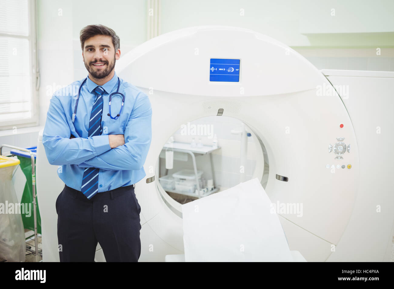 Portrait of doctor standing near mri scanner Stock Photo - Alamy