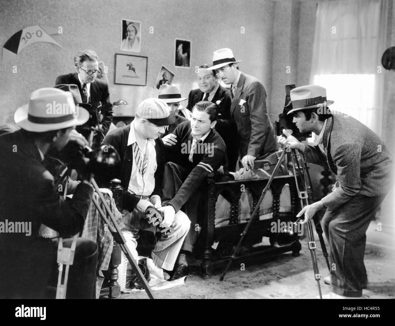 SATURDAY'S MILLIONS, Paul Hurst (cap), Robert Young (raised foot), 1933 ...