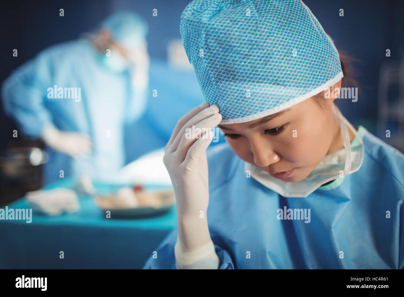 Female surgeon in operation room Stock Photo - Alamy