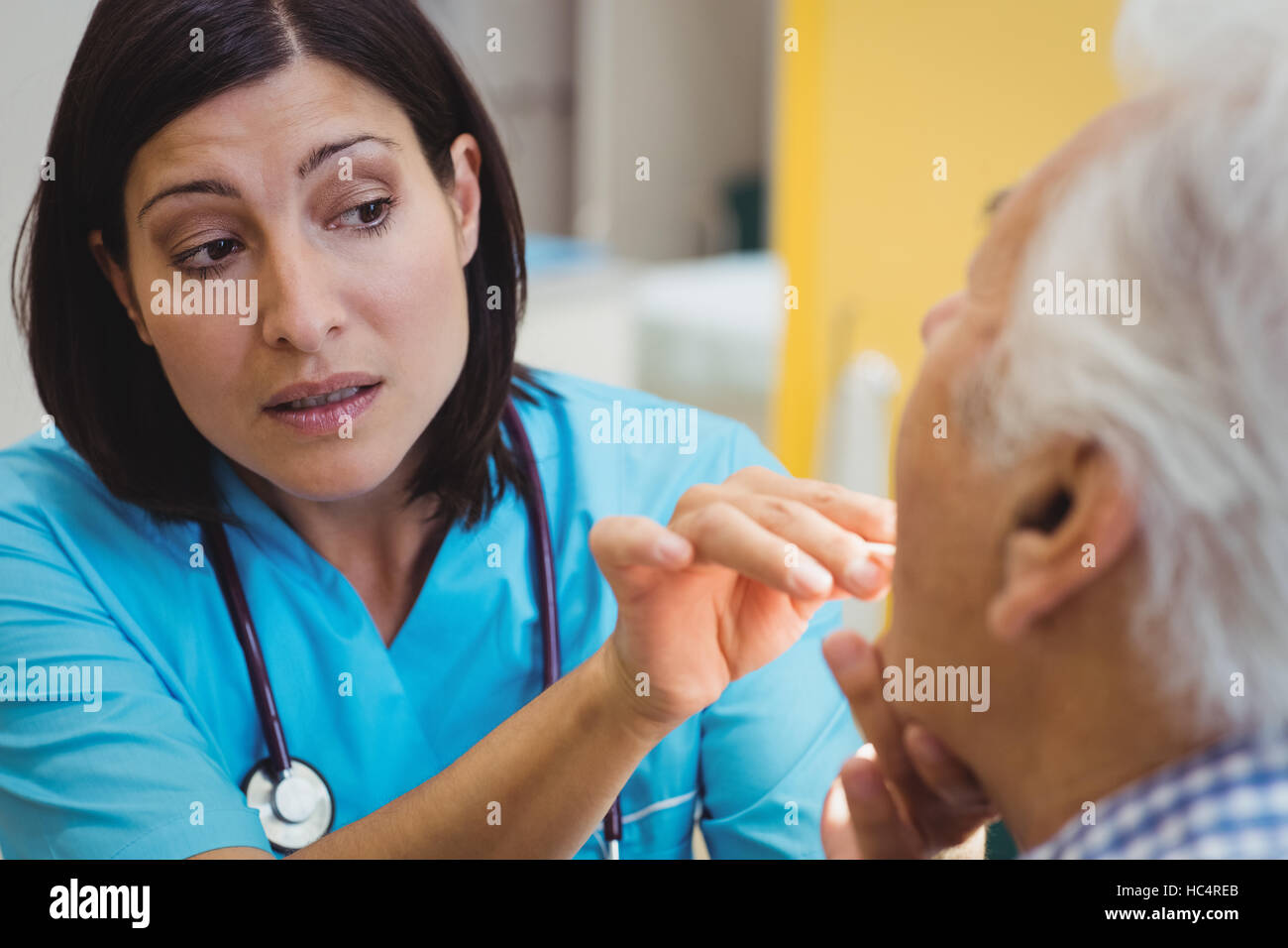 Doctor examining a patient Stock Photo - Alamy