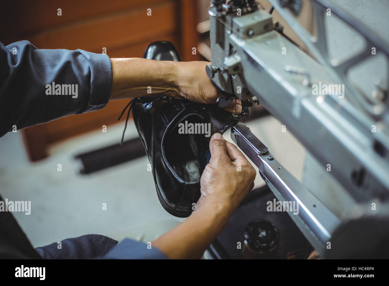 Shoemaker using sewing machine Stock Photo - Alamy