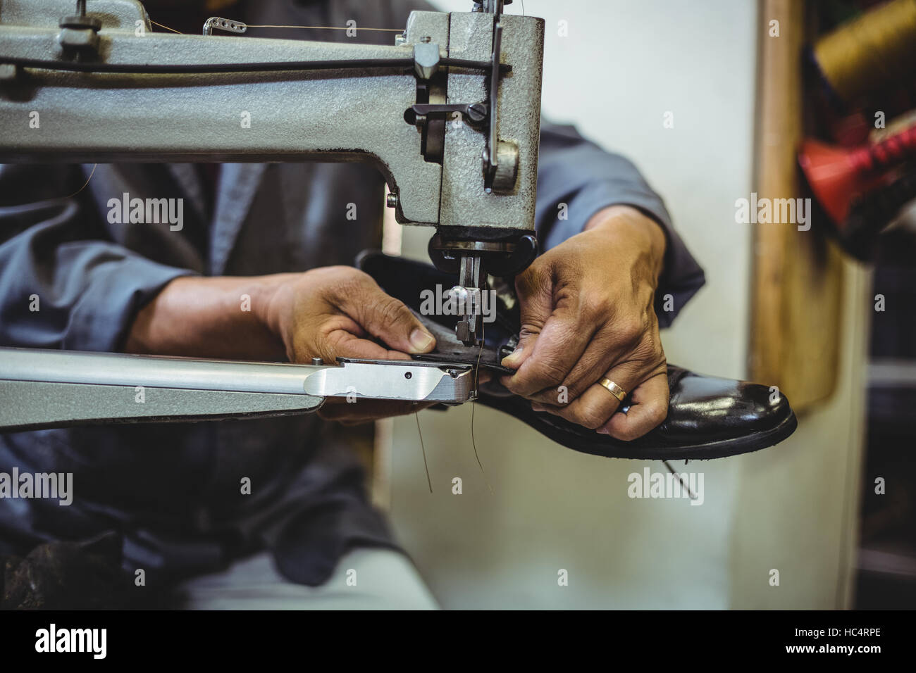 Shoemaker using sewing machine Stock Photo - Alamy