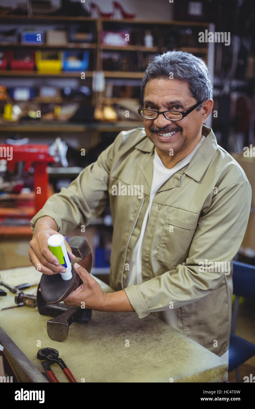 Worker applying glue shoe sole hi-res stock photography and images - Alamy