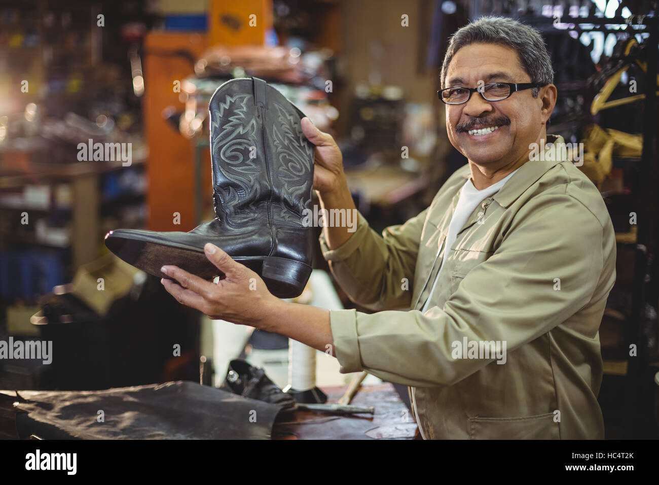 Holding boot hi-res stock photography and images - Alamy